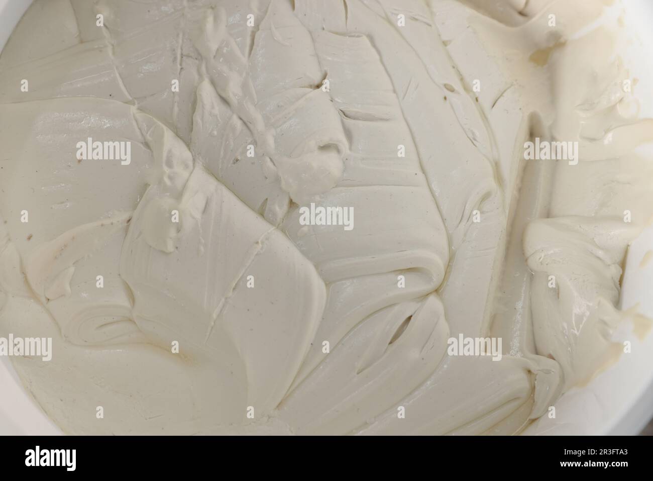 Texture of plaster in bucket, top view Stock Photo - Alamy