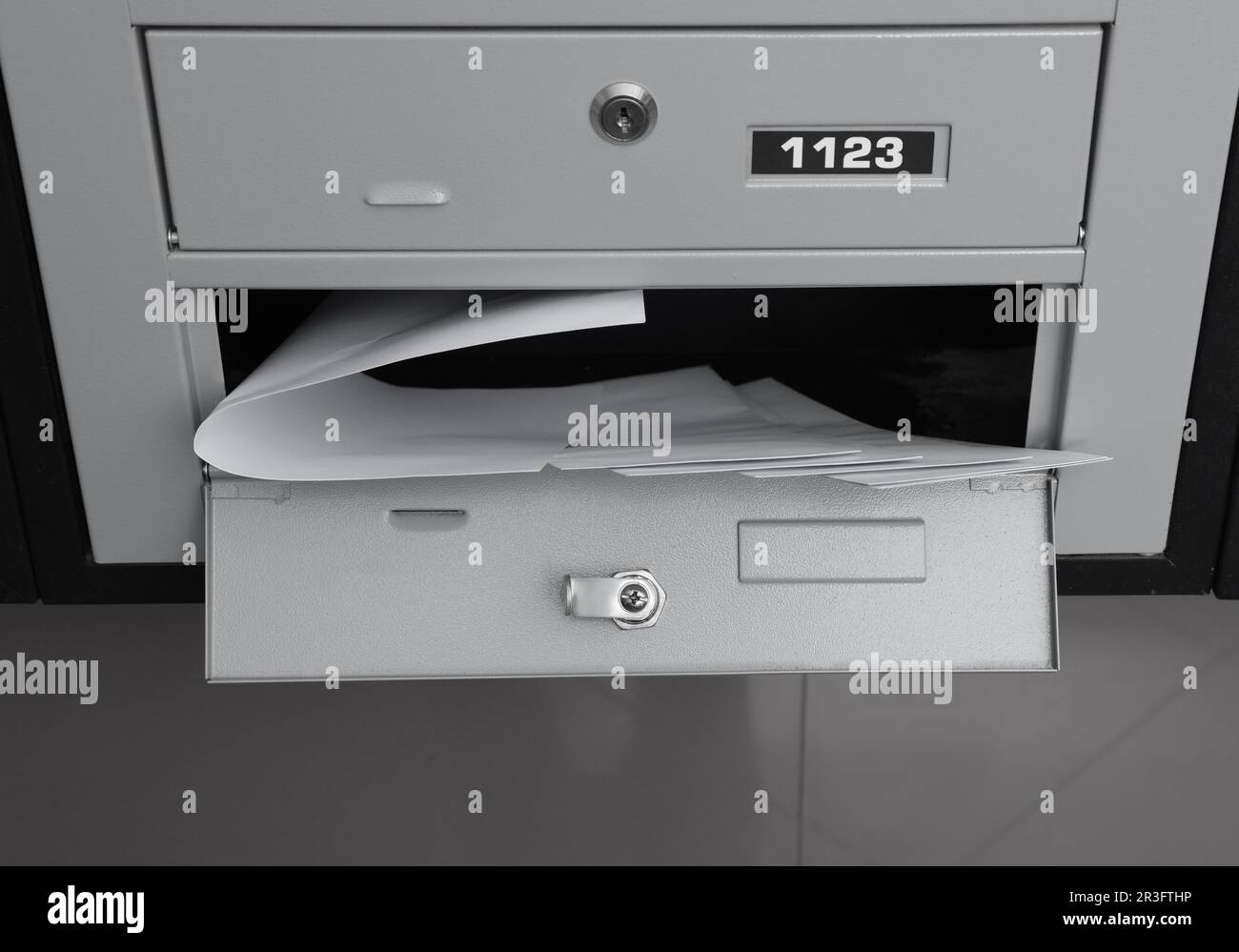 Open grey metal mailbox with envelopes indoors Stock Photo - Alamy