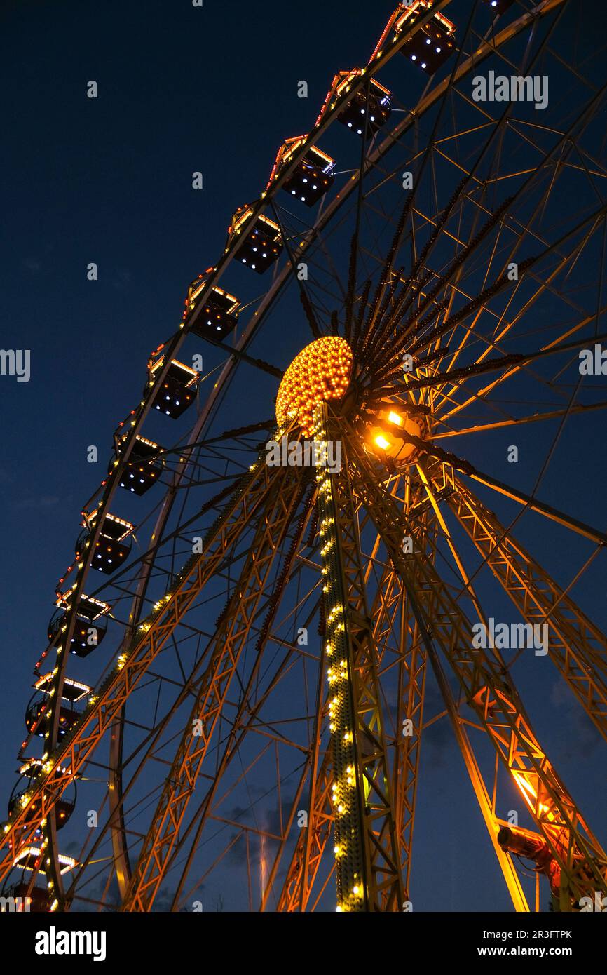 Ferris Wheel Lights at Night. Neon colored lights flashing on the Ferris wheel. Amusement park ...