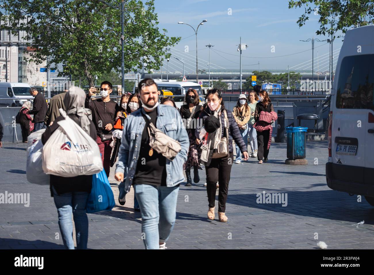 Picture of people wearing a respiratory face mask in the center of ...