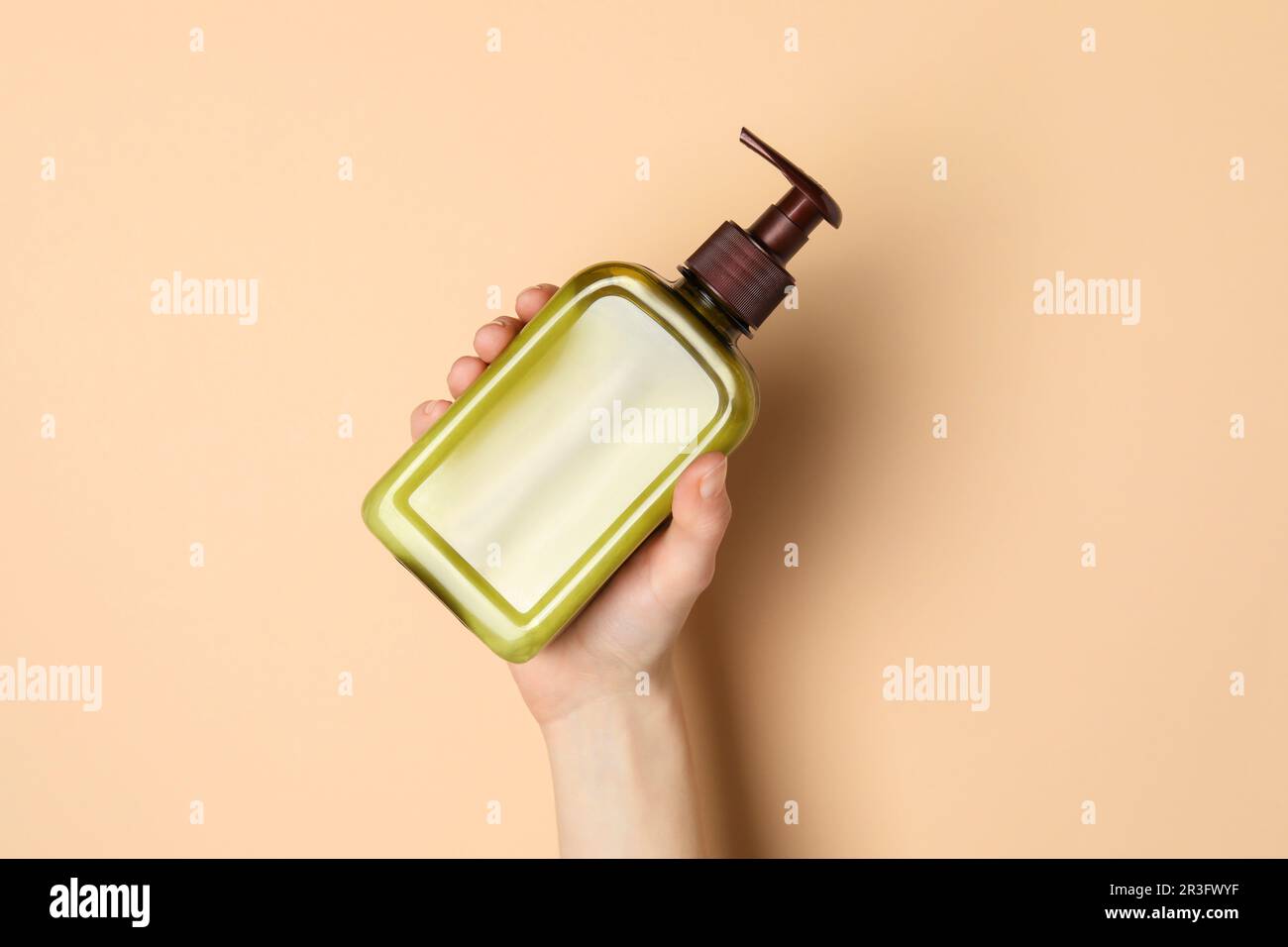 Hand holding shampoo hi-res stock photography and images - Alamy