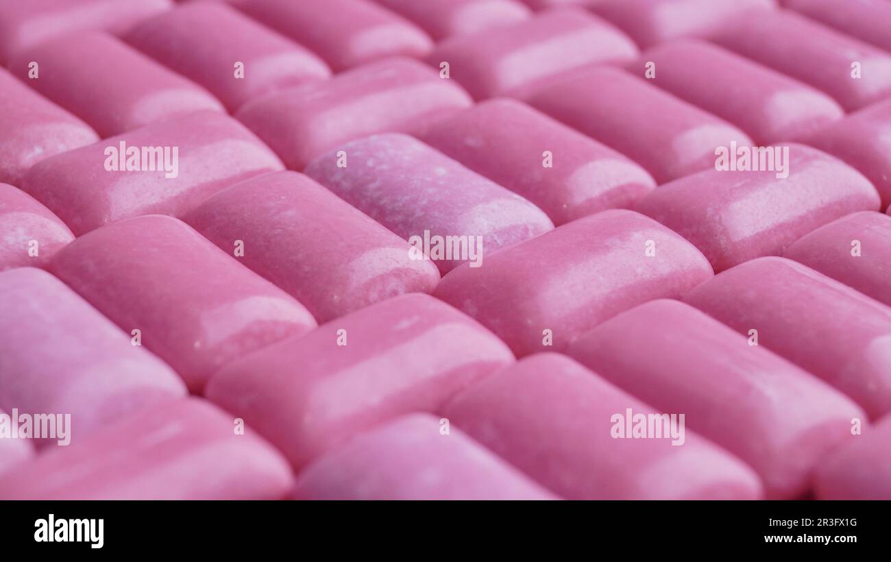 Many pink chewing gums as background, closeup Stock Photo - Alamy