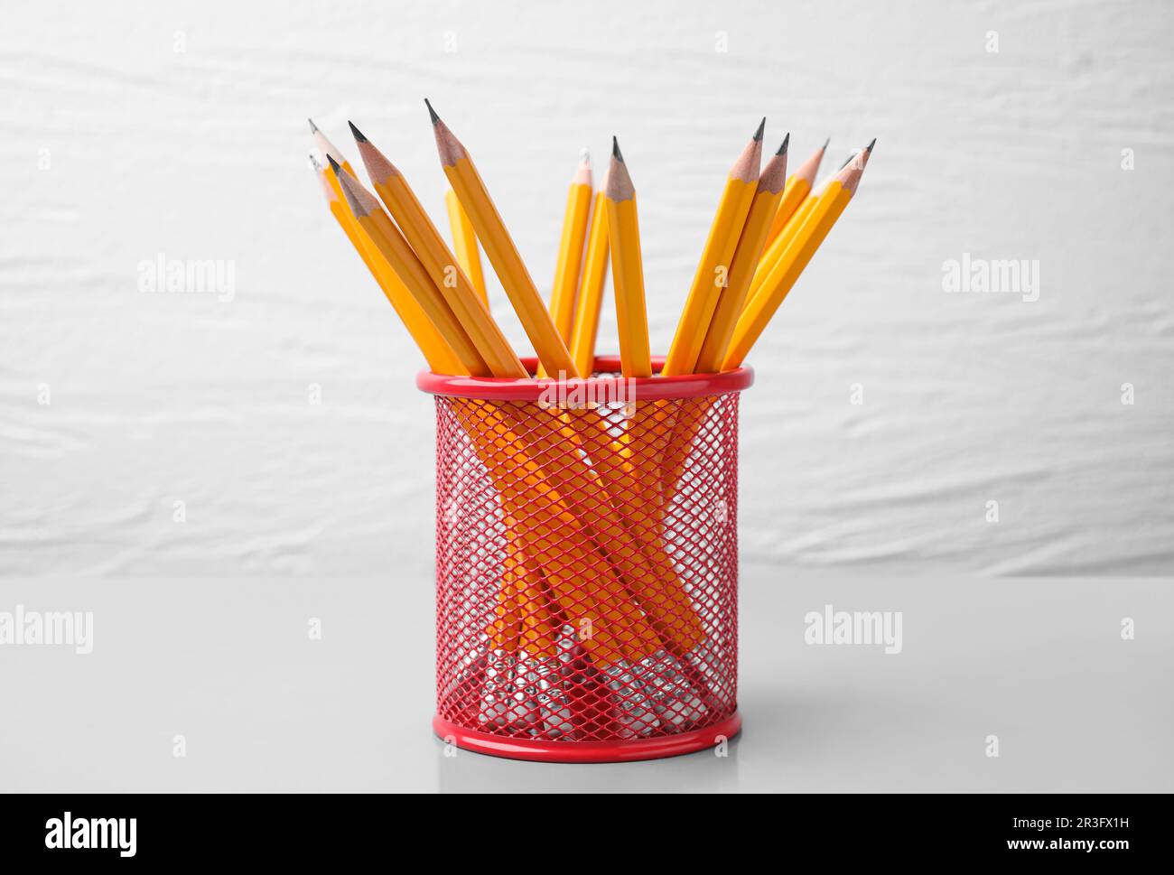 Many sharp pencils in holder on white background Stock Photo - Alamy