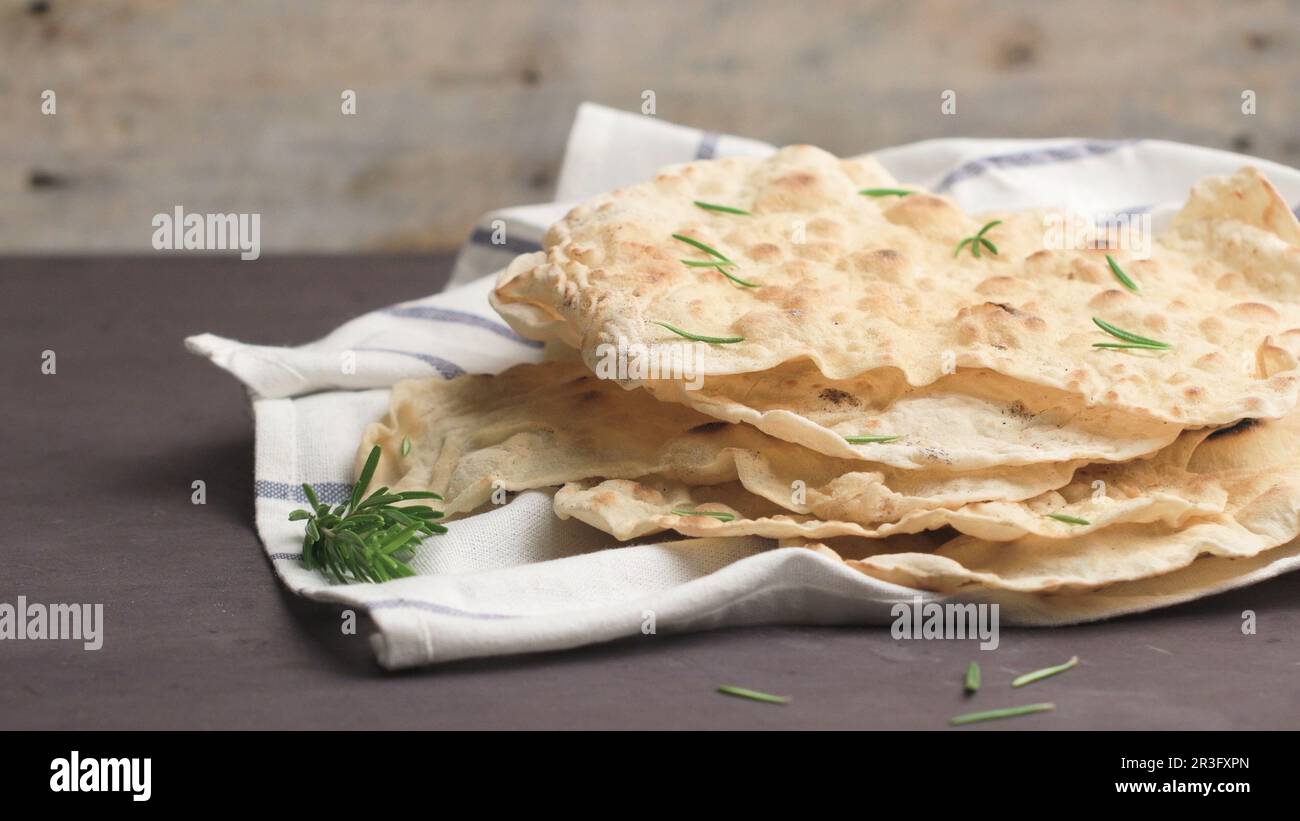 Homemade hot chapati on kitchen countertop background. Rotating slide ...