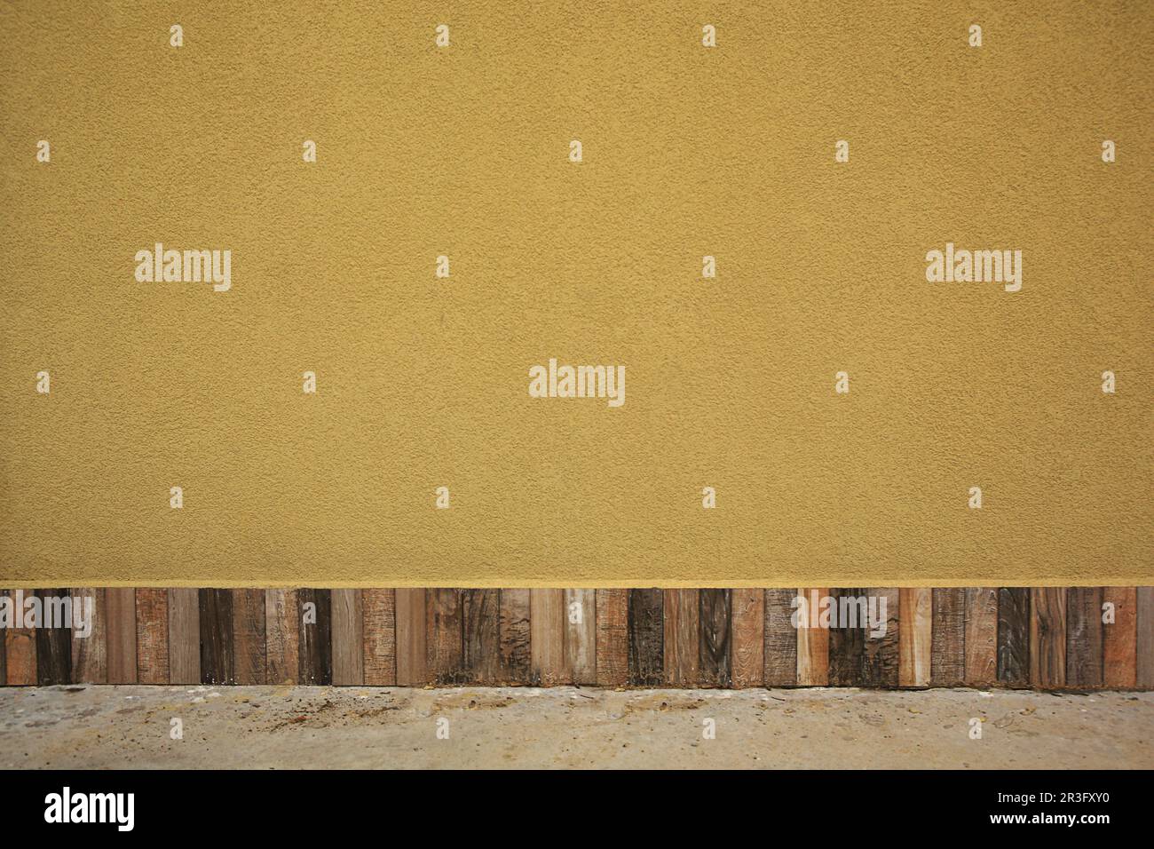 Beautiful yellow textured wall and concrete floor Stock Photo - Alamy