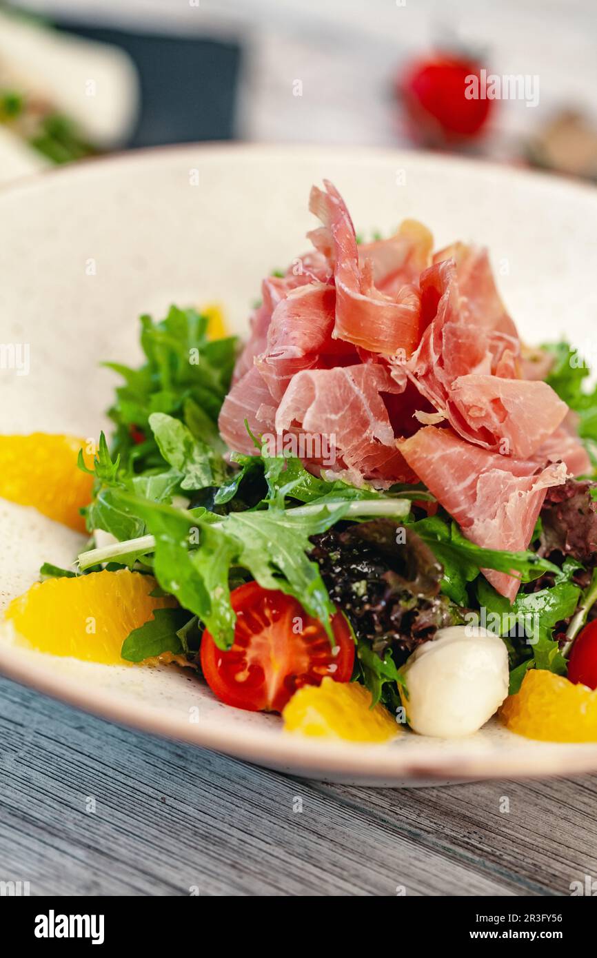 Restaurant Starter Menu of Veggie Salad with Meat slices Stock Photo ...