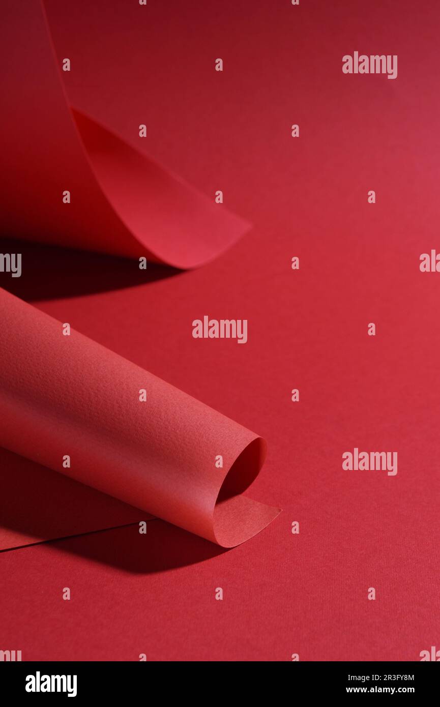 Paper sheets on red background, space for text Stock Photo - Alamy