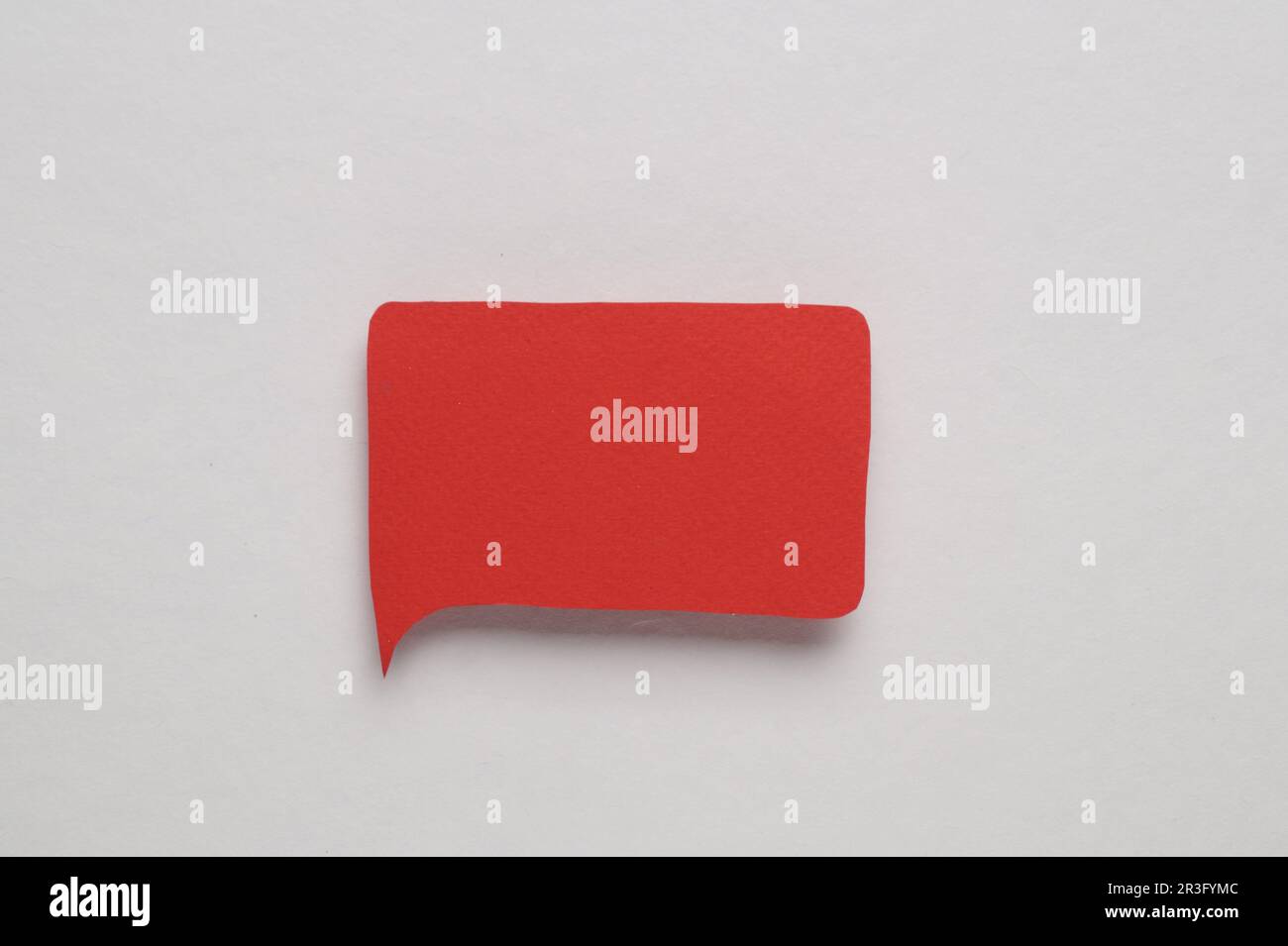 Red paper speech bubble on white background, top view. Space for text ...