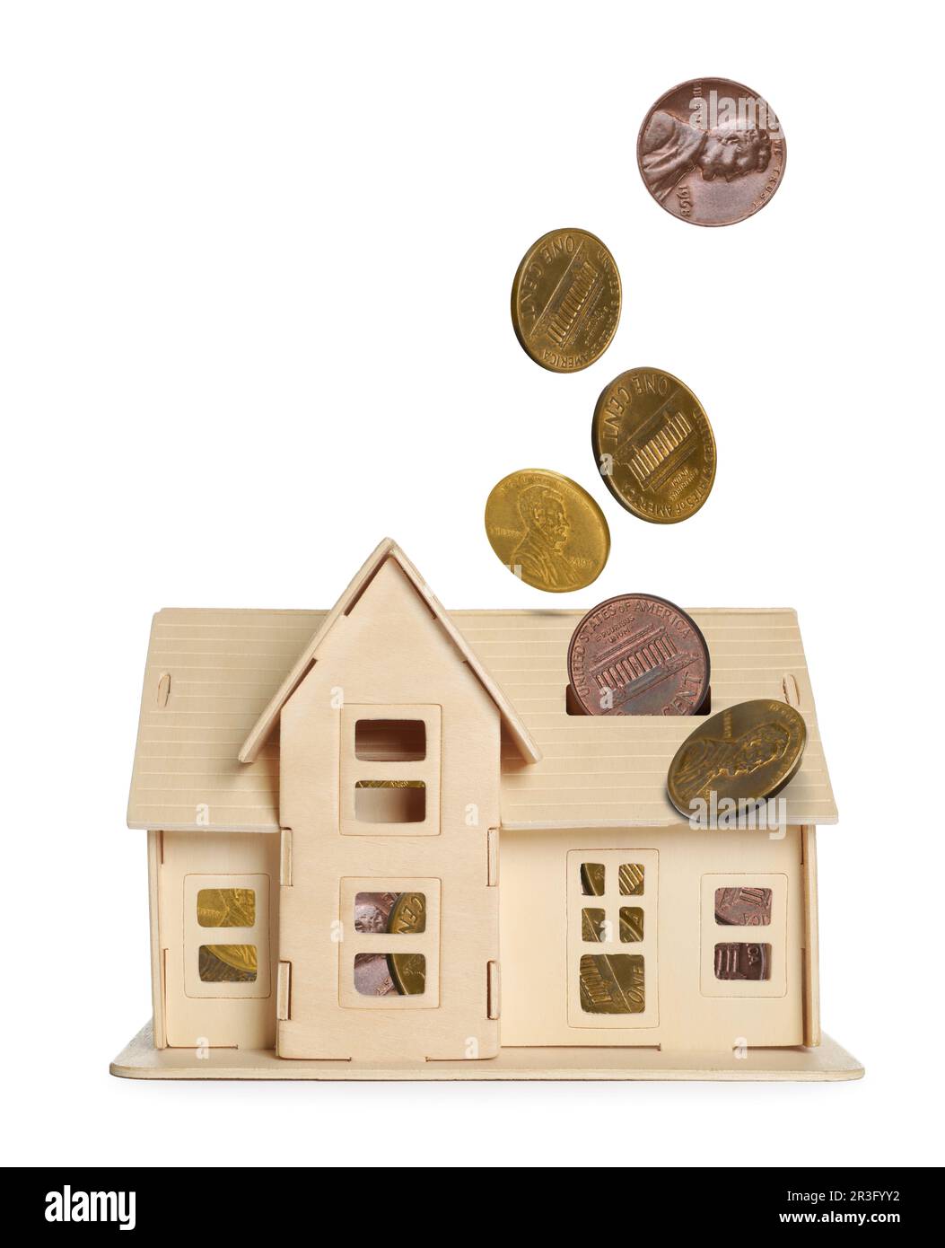 Coins falling into house shaped money box on white background Stock ...