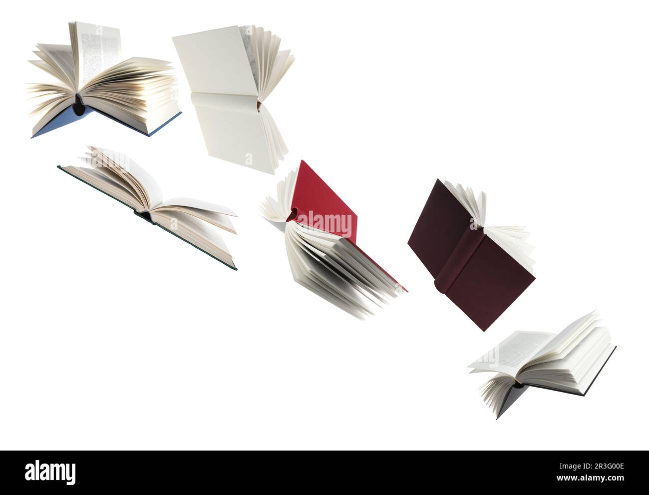 Many hardcover books flying on white background Stock Photo - Alamy