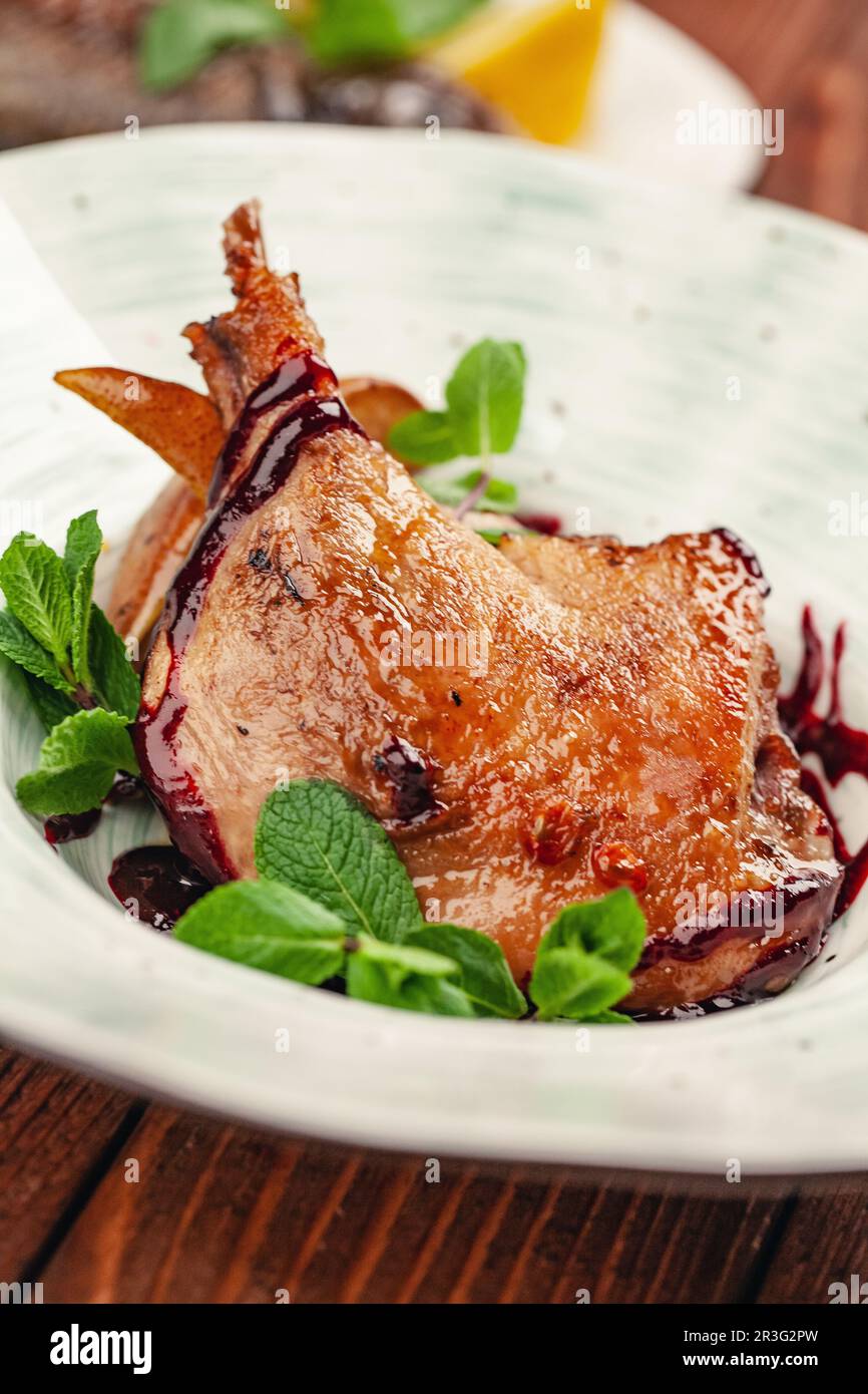 roasted duck leg steak with orange sauce Stock Photo - Alamy