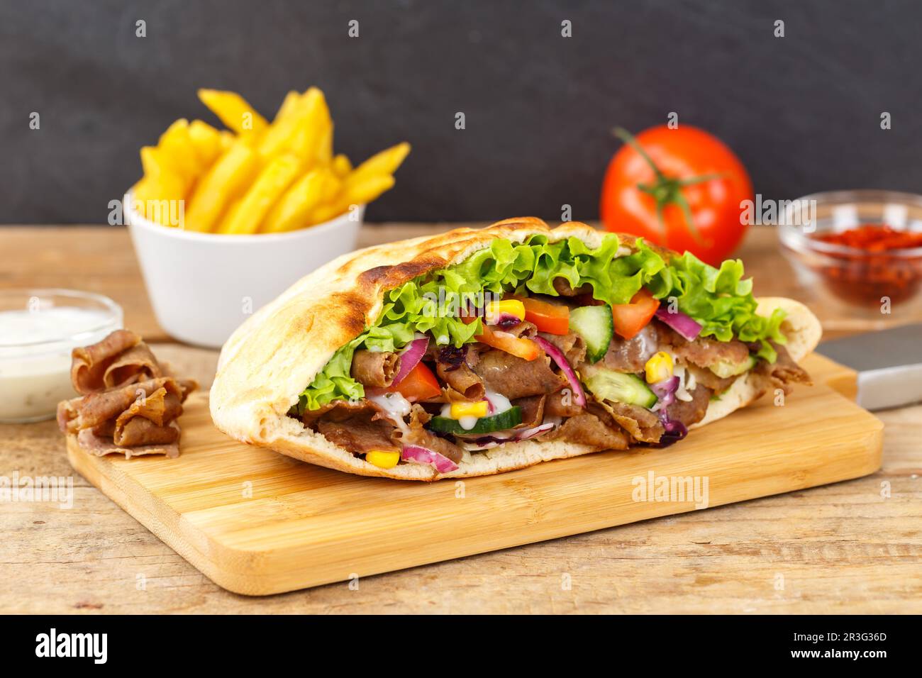Doner kebab Doner kebab half fast food food in pita bread with fries on ...