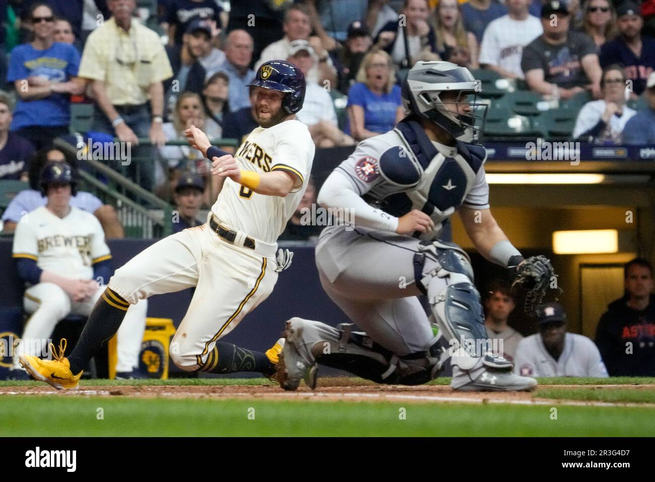 Milwaukee Brewers' Owen Miller slides safely home past Houston Astros ...