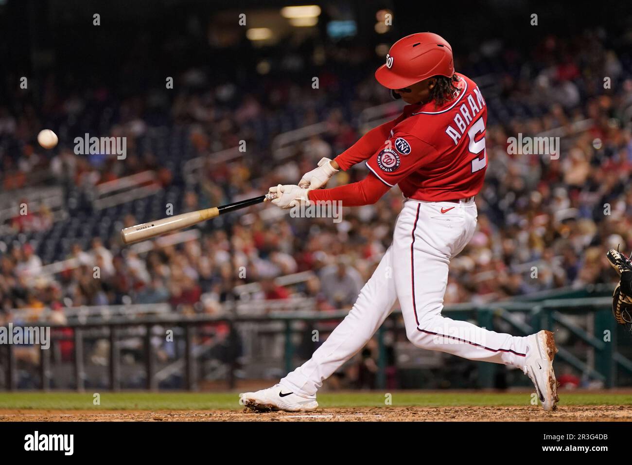 Washington Nationals' CJ Abrams (5) hits a two-run homer during the fifth inning of a baseball ...