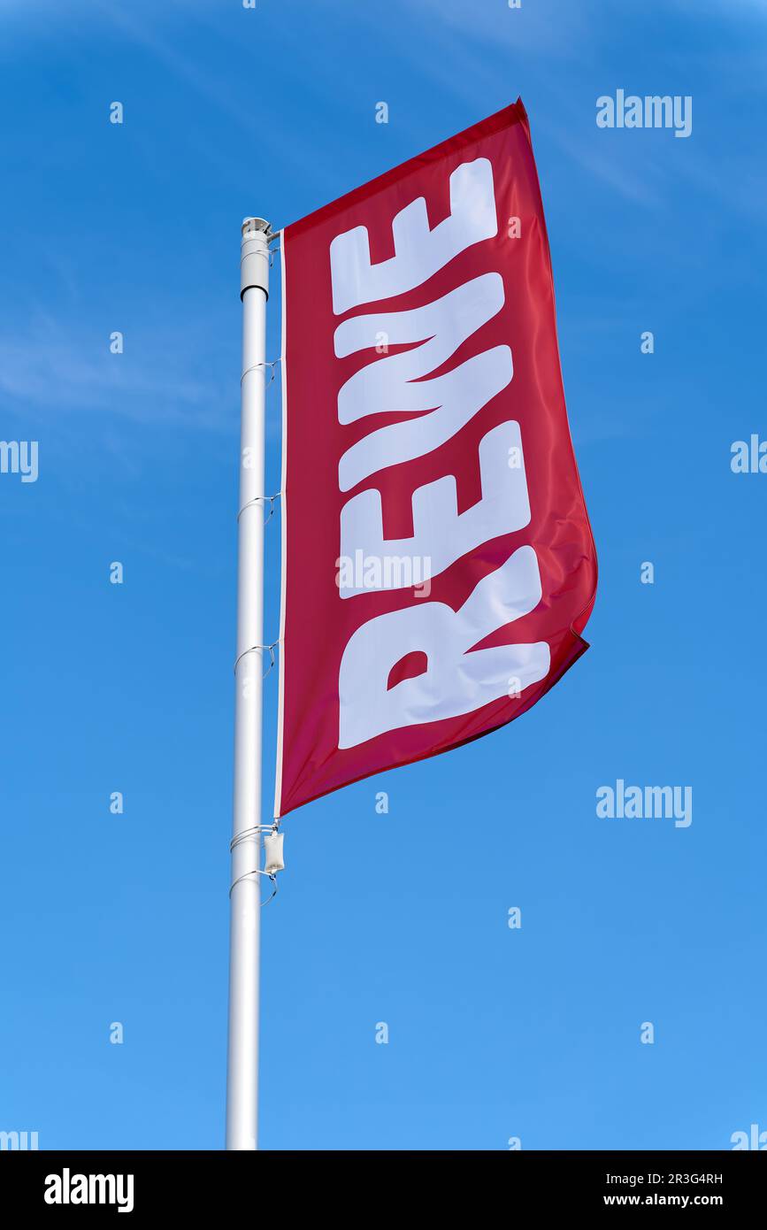 Flag in front of the new central warehouse of the German food retailer ...