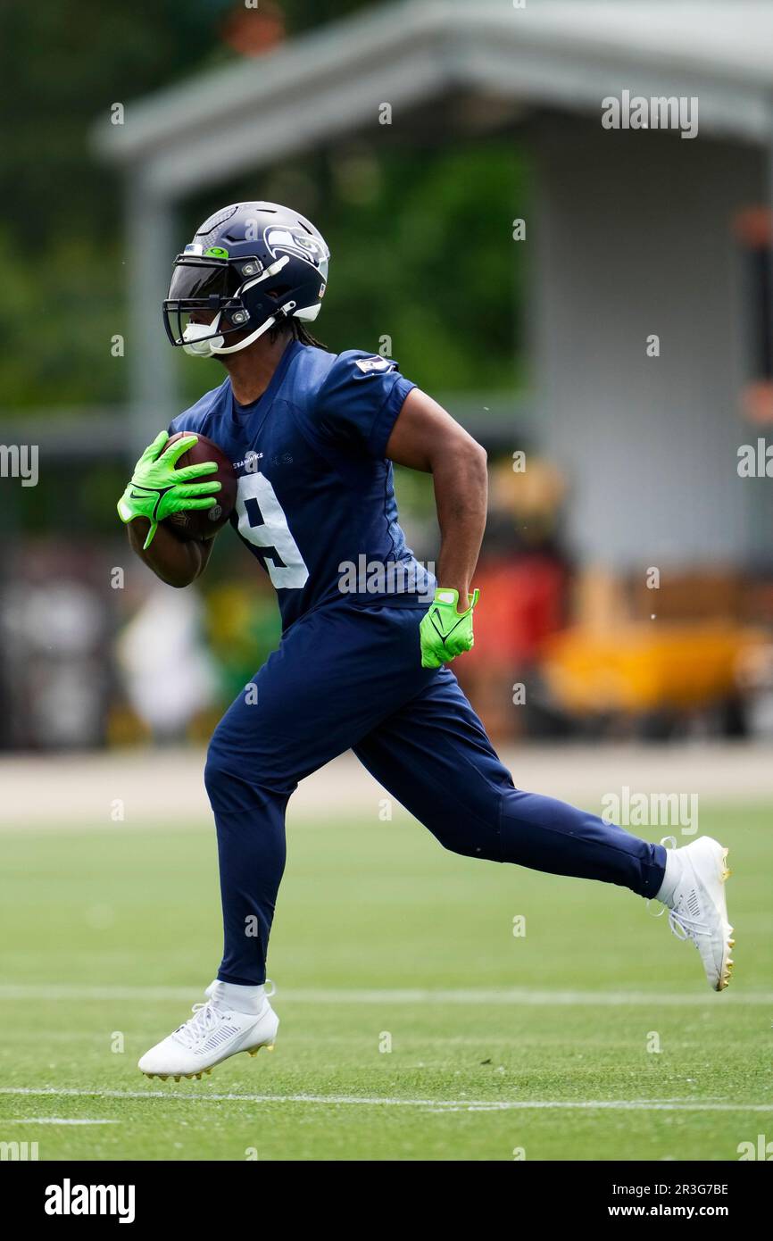 Seattle Seahawks running back Kenneth Walker III (9) holds a football ...
