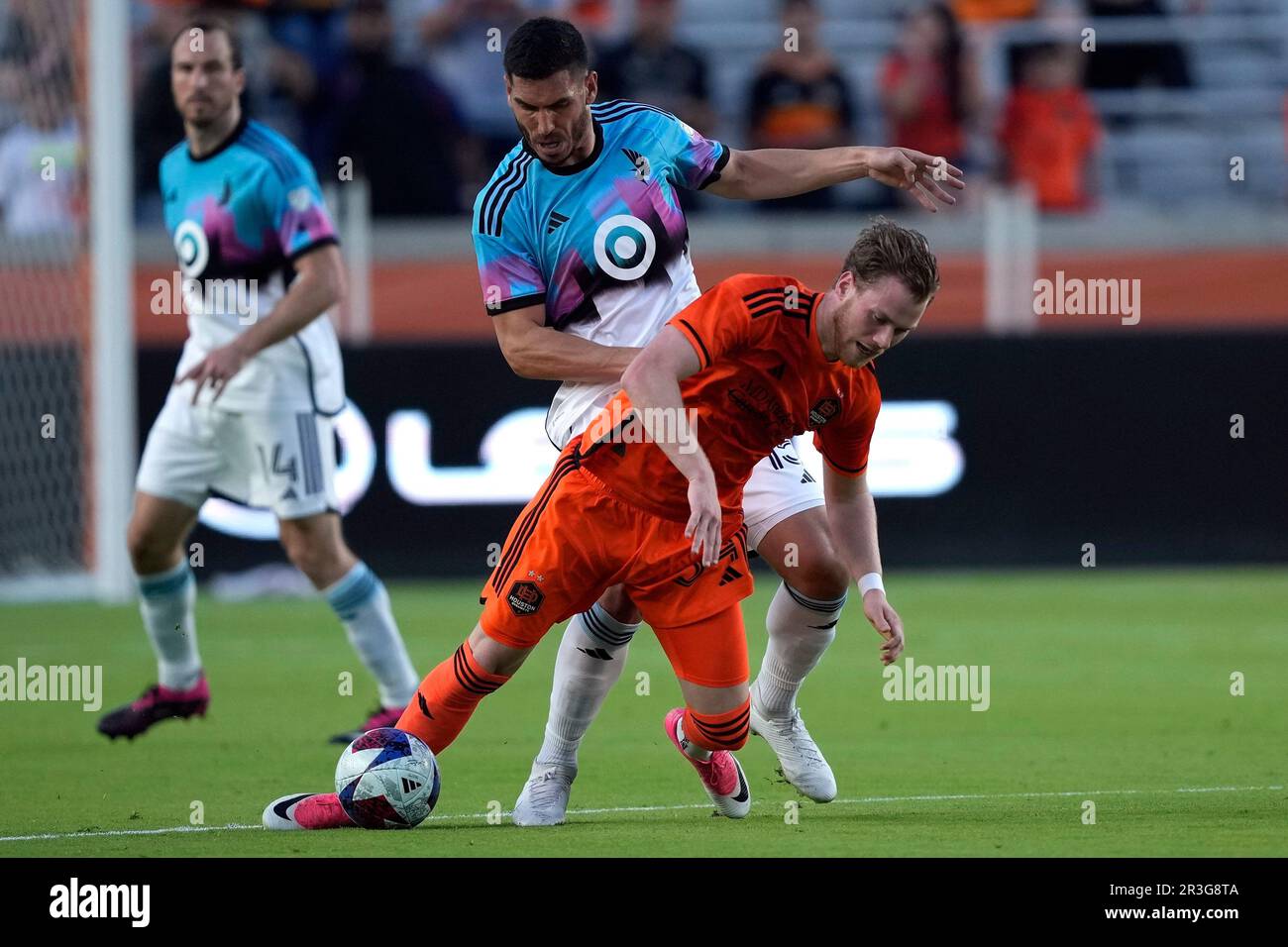 Houston Dynamo's Thor Úlfarsson, right, is fouled by Minnesota United's ...