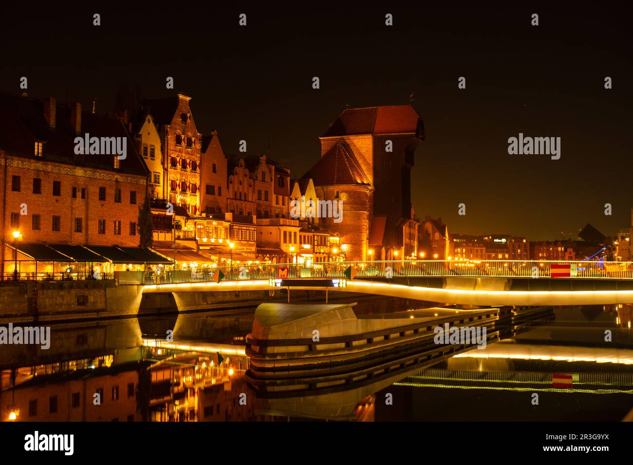 Old town in Gdansk at night. The riverside on Granary Island reflection ...