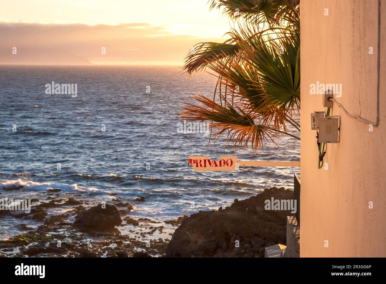 A sign reads "Privado" at a private beach Stock Photo - Alamy