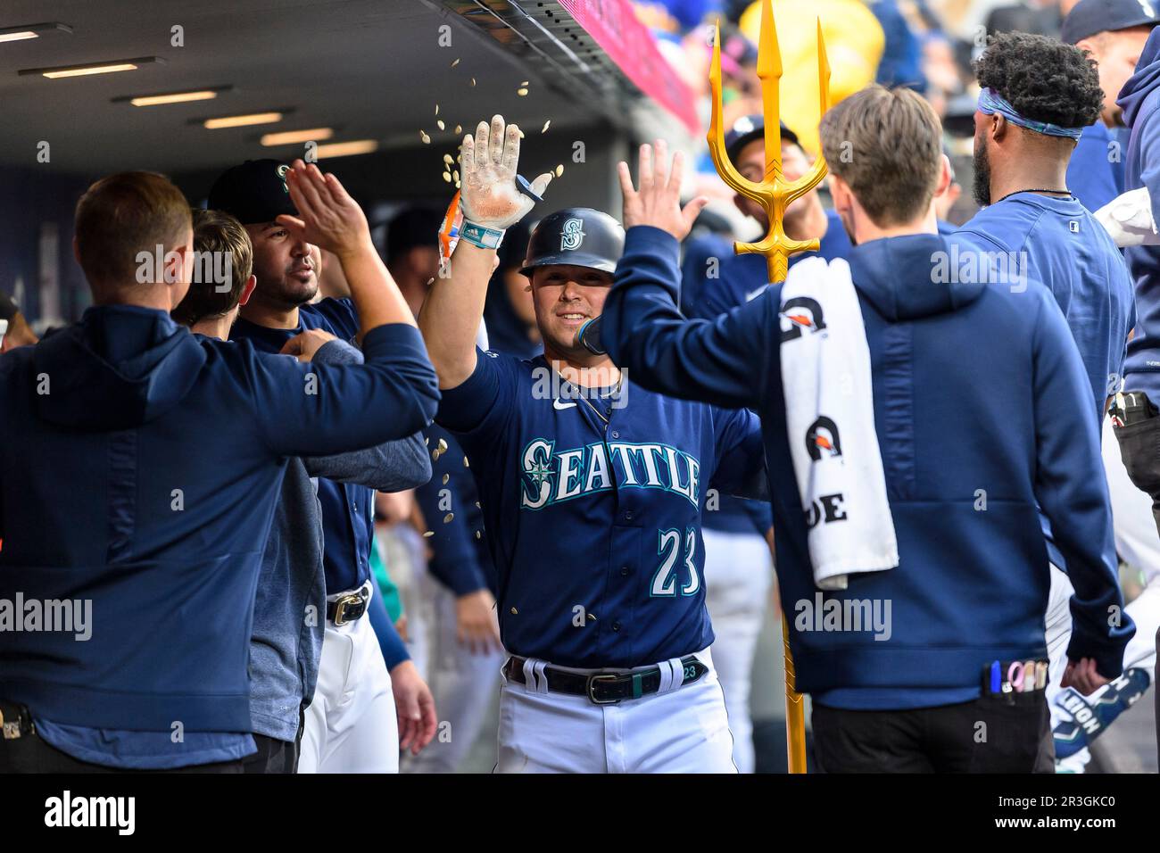 Seattle Mariners' Ty France (23) is congratulated in the dugout after ...