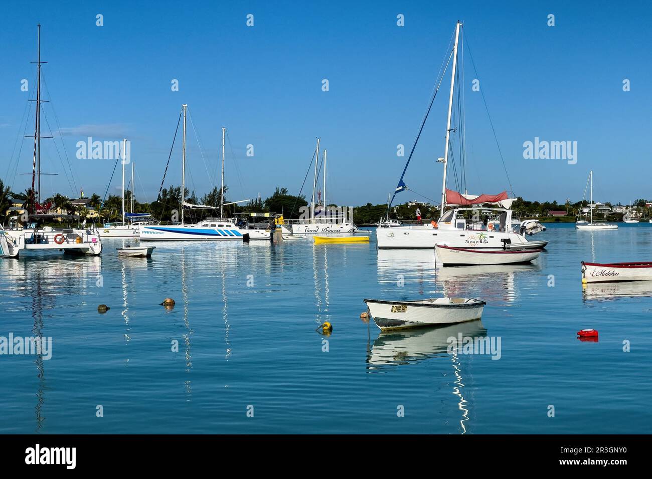 In front Small motorboat behind Sport boats Catamaran lies at anchor in ...
