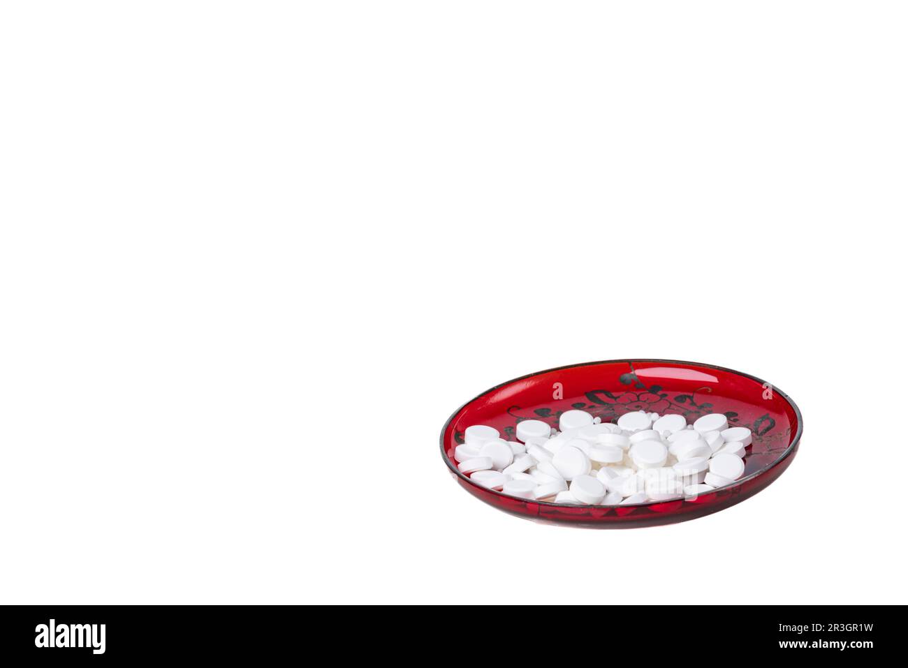 Homeopathic tablets on plate, white background, copy room Stock Photo ...