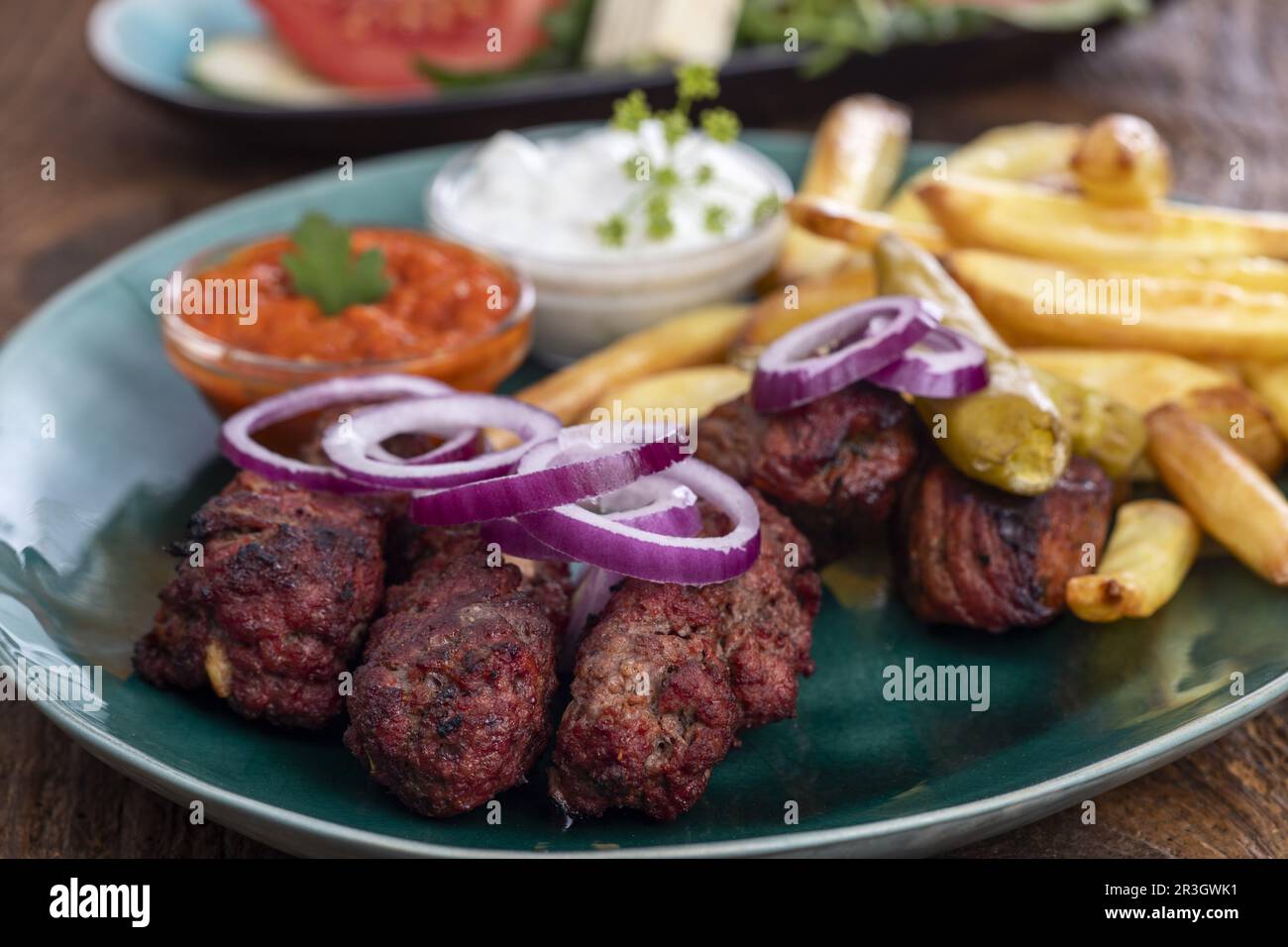 Greek bifteki with french fries Stock Photo - Alamy