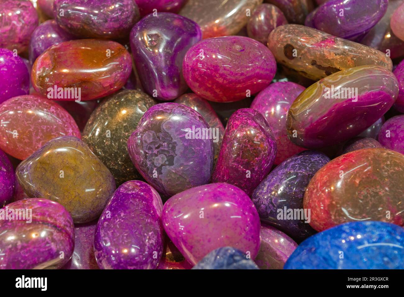 Purple semi-precious stones background Stock Photo - Alamy