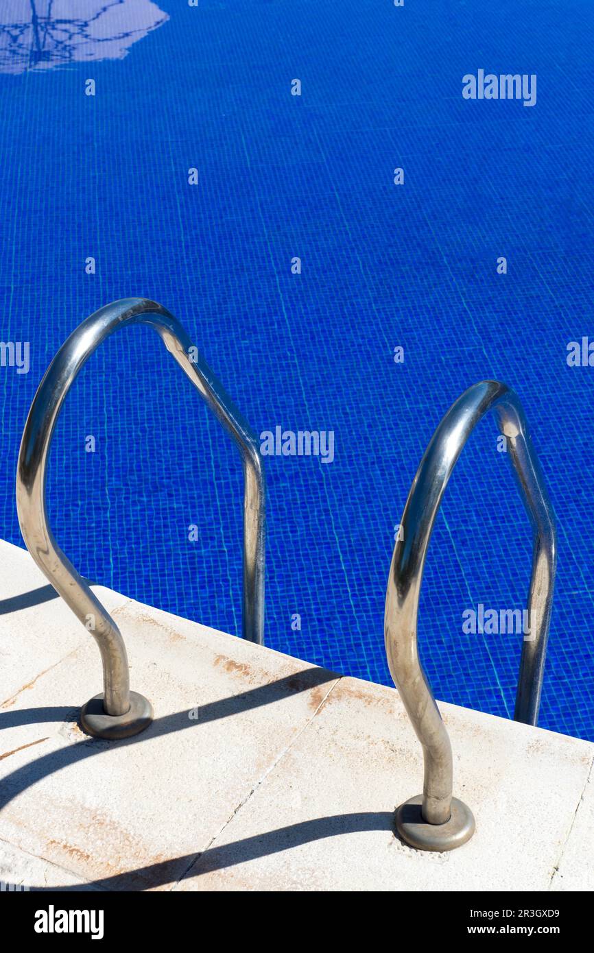 Entering a swimming pool with deep blue water Stock Photo - Alamy