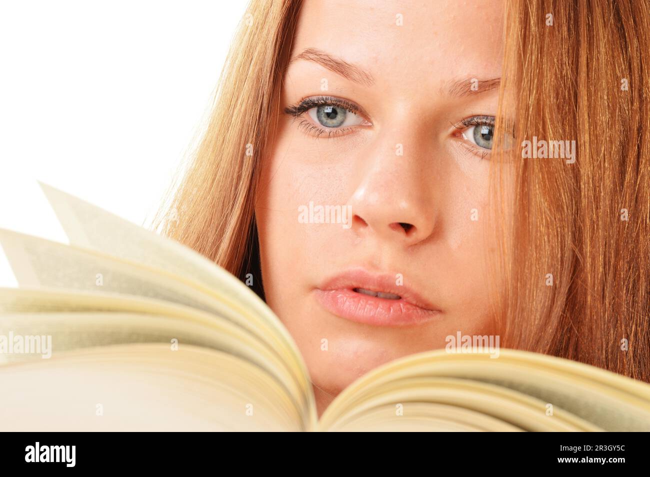 Young woman reading a book. Female student learning Stock Photo - Alamy