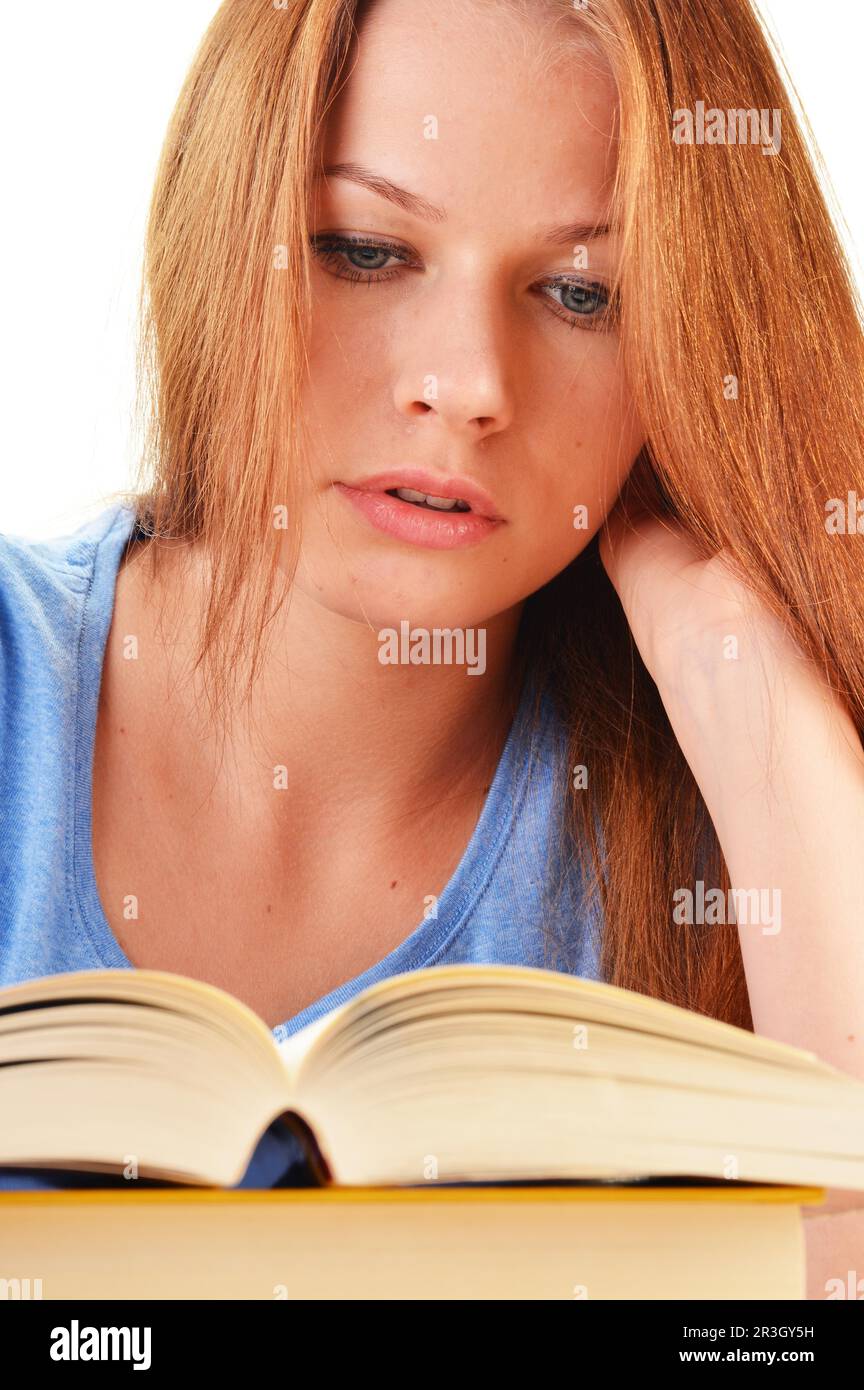 Young woman reading a book. Female student learning Stock Photo - Alamy