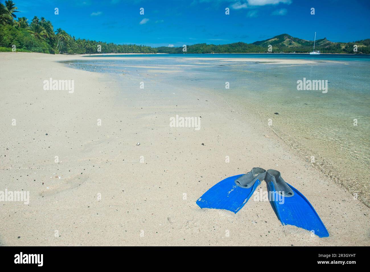 Flippers in the water of the blue lagoon, Yasawas, Fiji, South Pacific ...