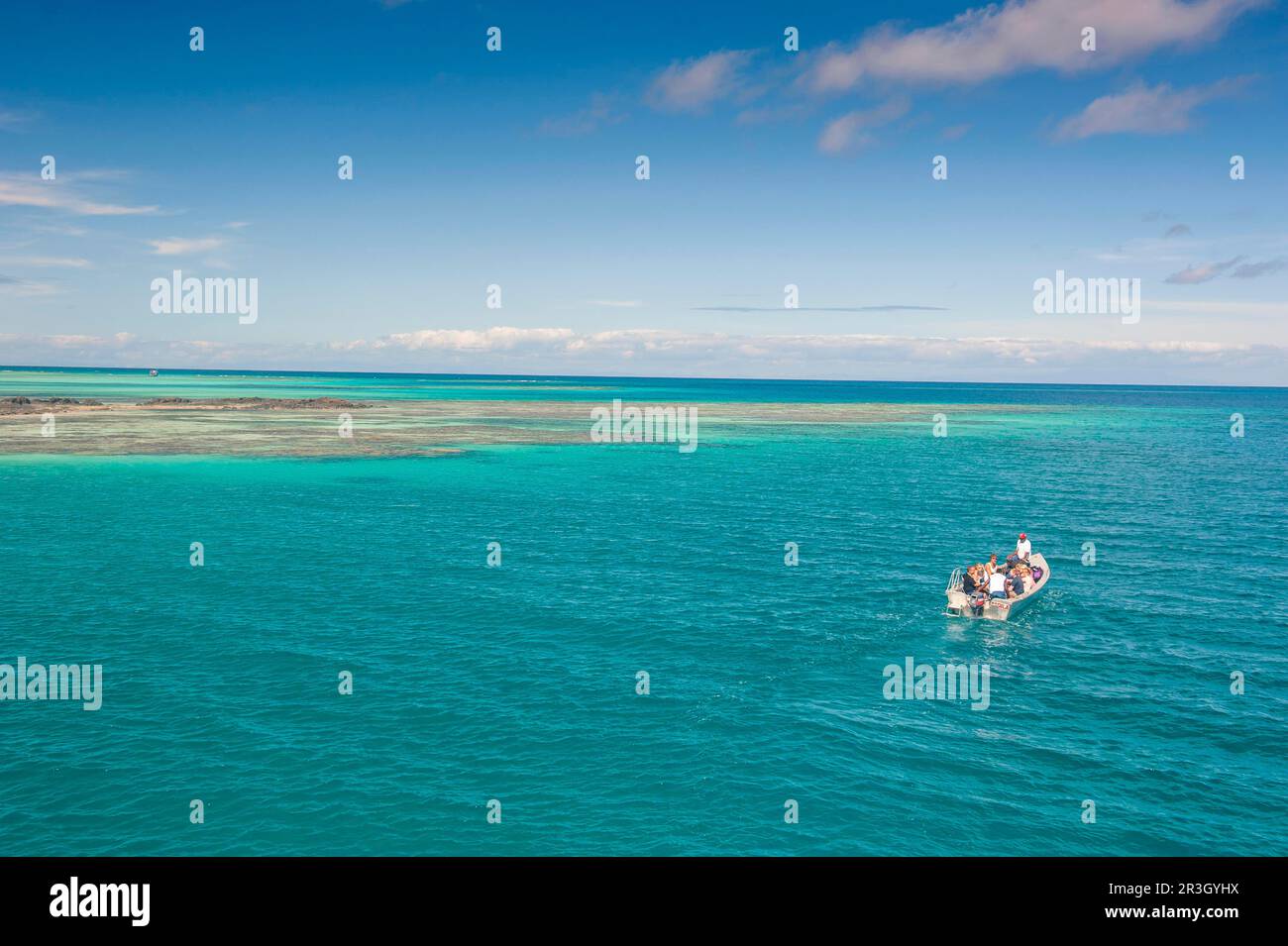 Little boat in the blue lagoon, Yasawas, Fiji, South Pacific Stock ...