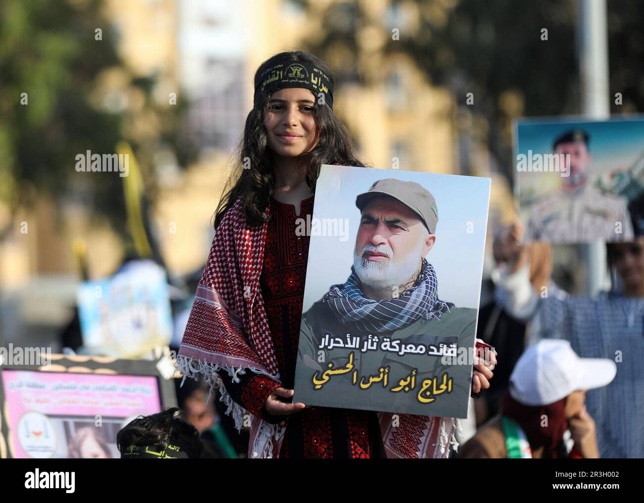 Gaza, Palestine. 19th May, 2023. A Palestinian girl holds a picture of ...