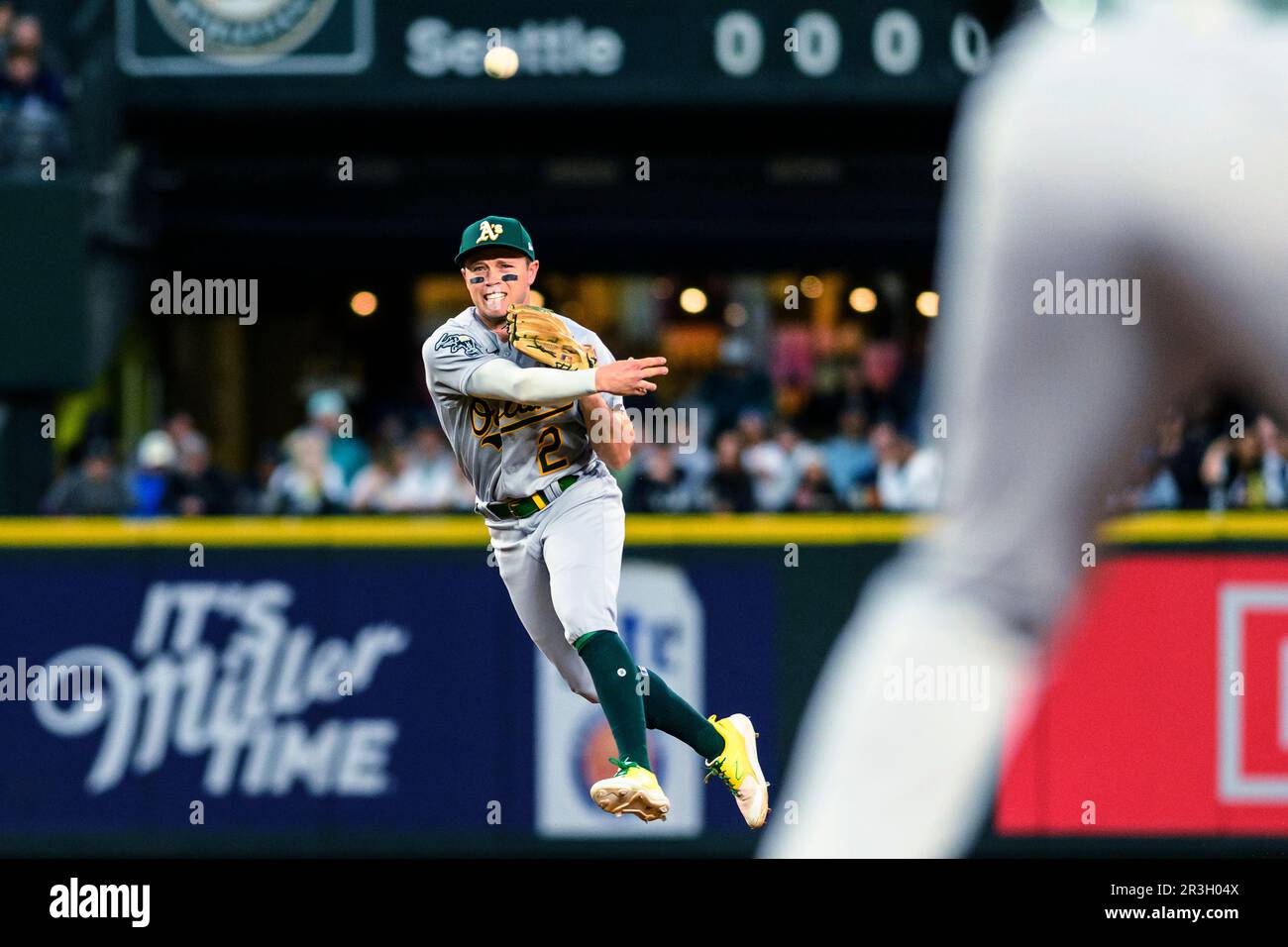 Oakland Athletics shortstop Nick Allen throws to first for the out on ...