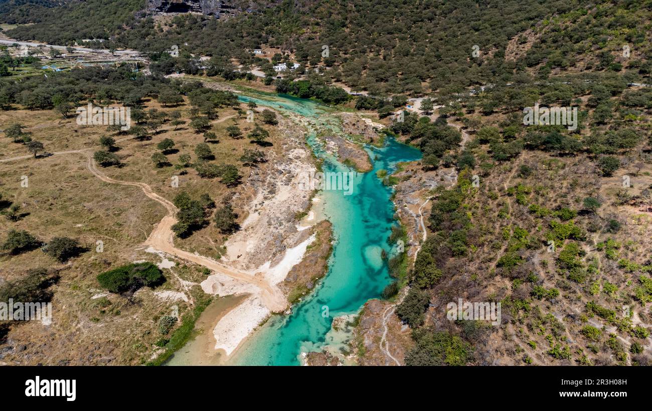 Aerial of a turquoise river in Wadi Darbat, Salalah, Oman Stock Photo ...