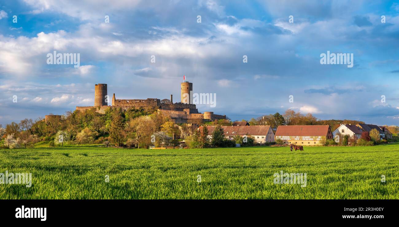 View of Muenzenberg Castle in the Wetterau under dark clouds in spring ...