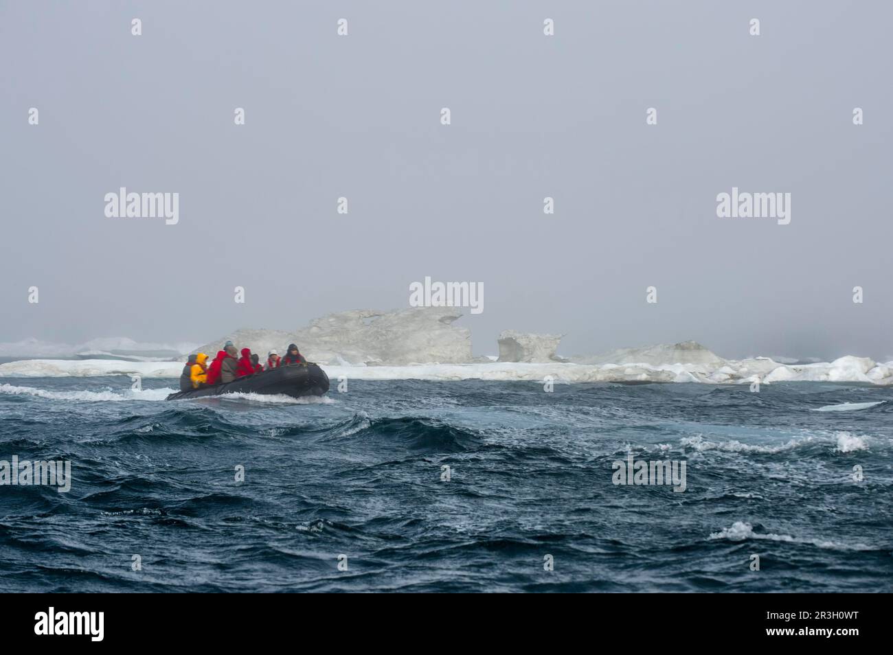 Zodiac with tourists approaching Herald Island, Chukchi Sea, Russian ...