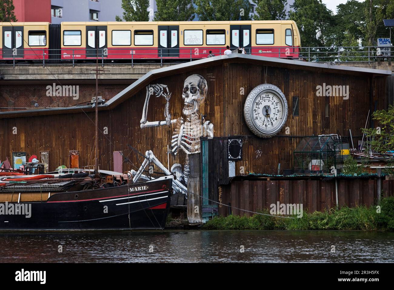 Scene on the Spree with a ship and a moving S-Bahn, Friedrichshain ...