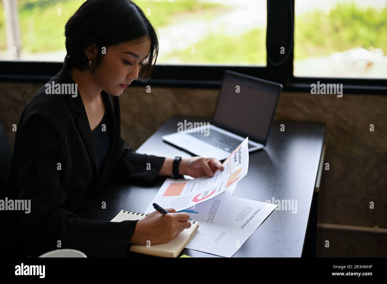 Side view, A professional millennial Asian female executive manager in ...