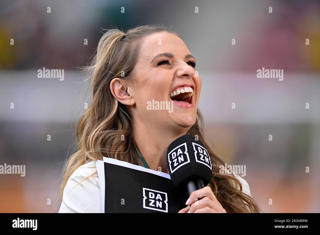 Presenter Laura Wontorra with microphone, mic, DAZN, logo, portrait ...