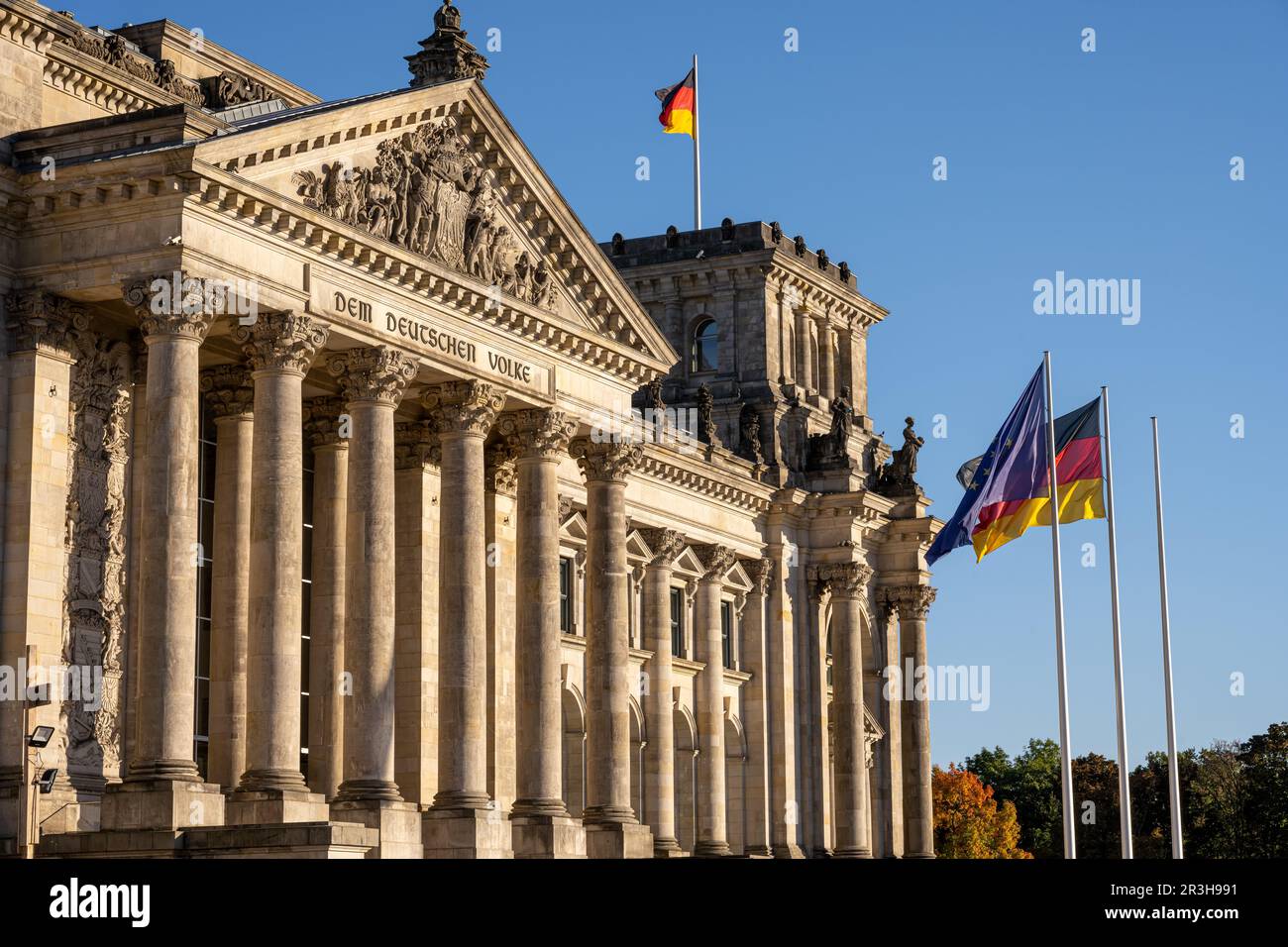 The entrance portal of the Reichstag in Berlin with EU and german flags ...
