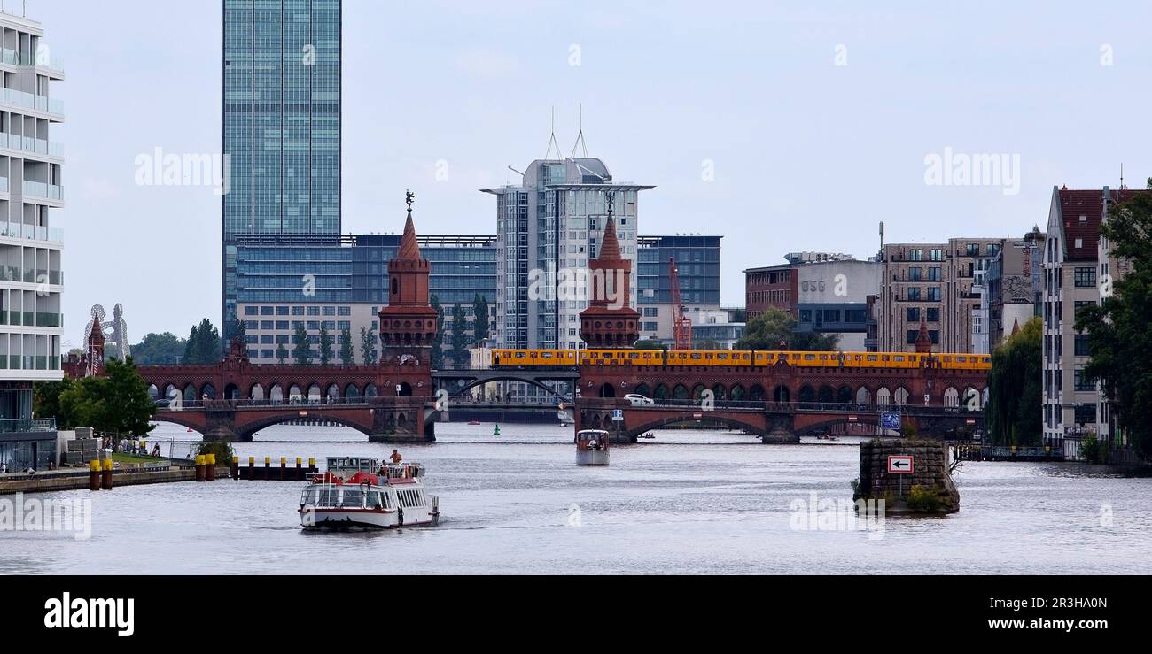 Spree river with Oberbaum bridge and Treptowers skyscraper, Berlin ...