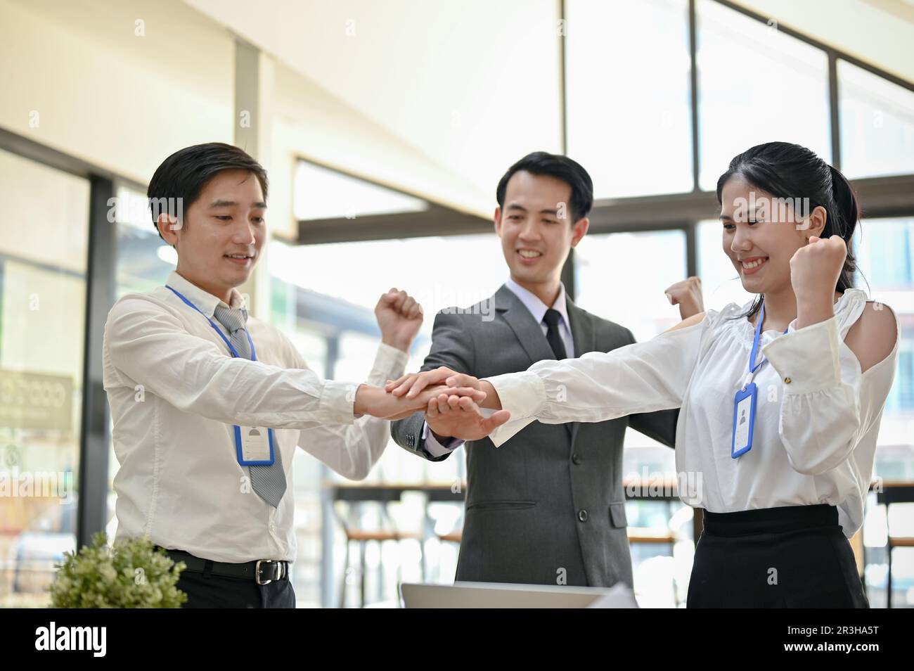 Businesspeople putting their hands together after the meeting. Team ...