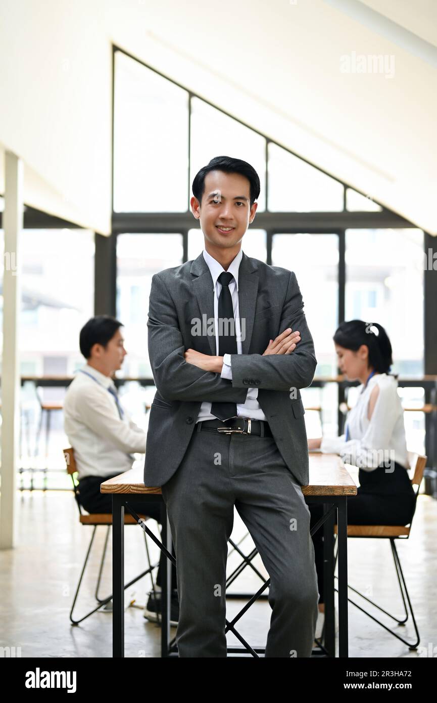 Portrait of a handsome and successful Asian male boss or businessman in ...