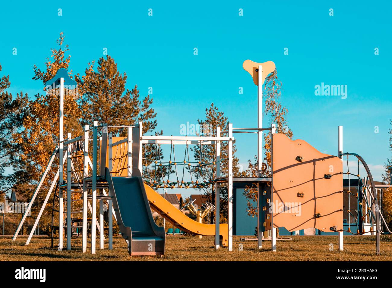 Colorful children playground during autumn season Stock Photo - Alamy