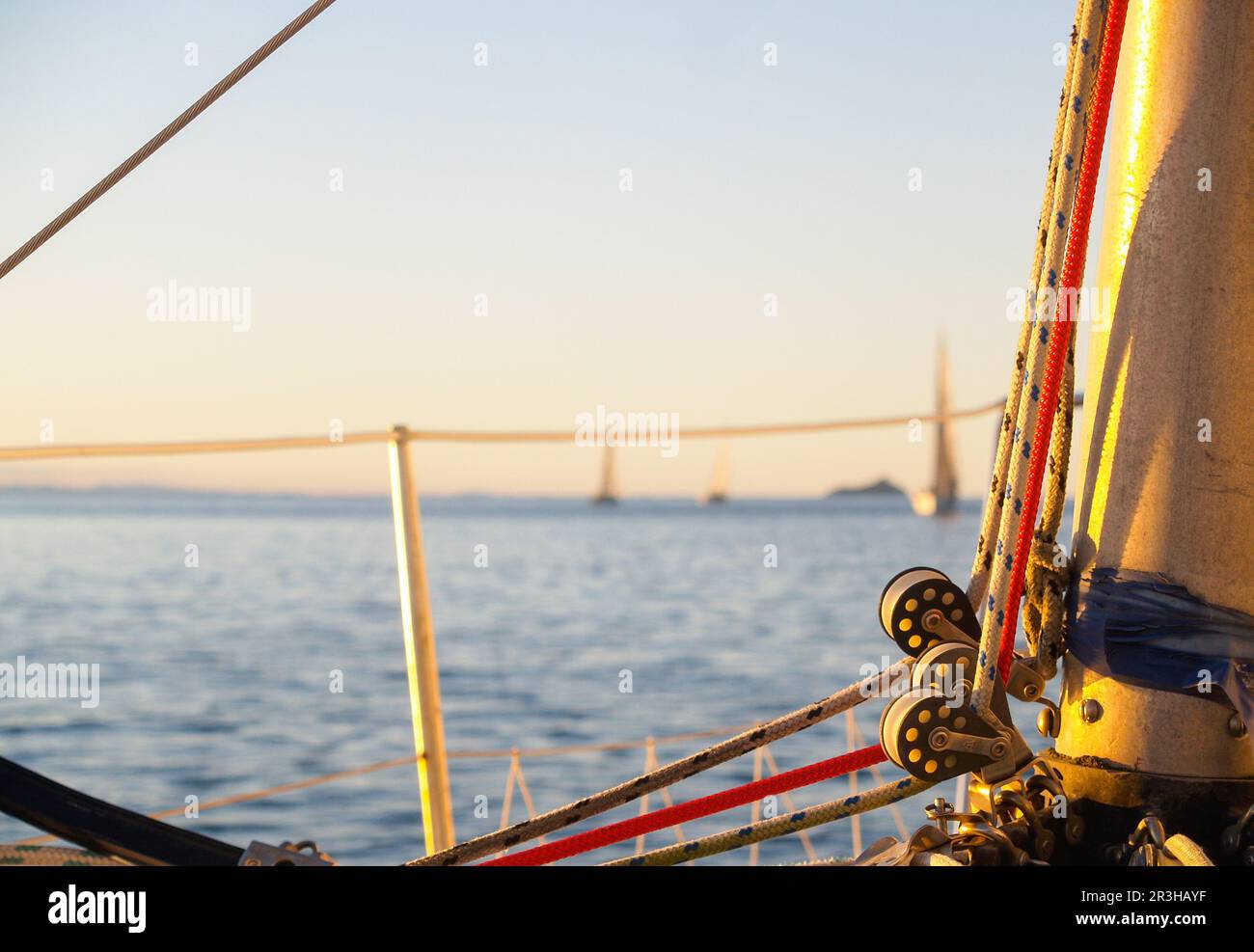 Nautical close-up rigging and pulleys at base of mast defocsed ...