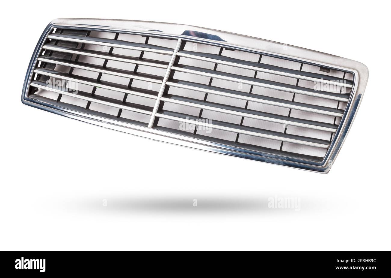radiator grille on a white background made of shiny chromed metal is an ...