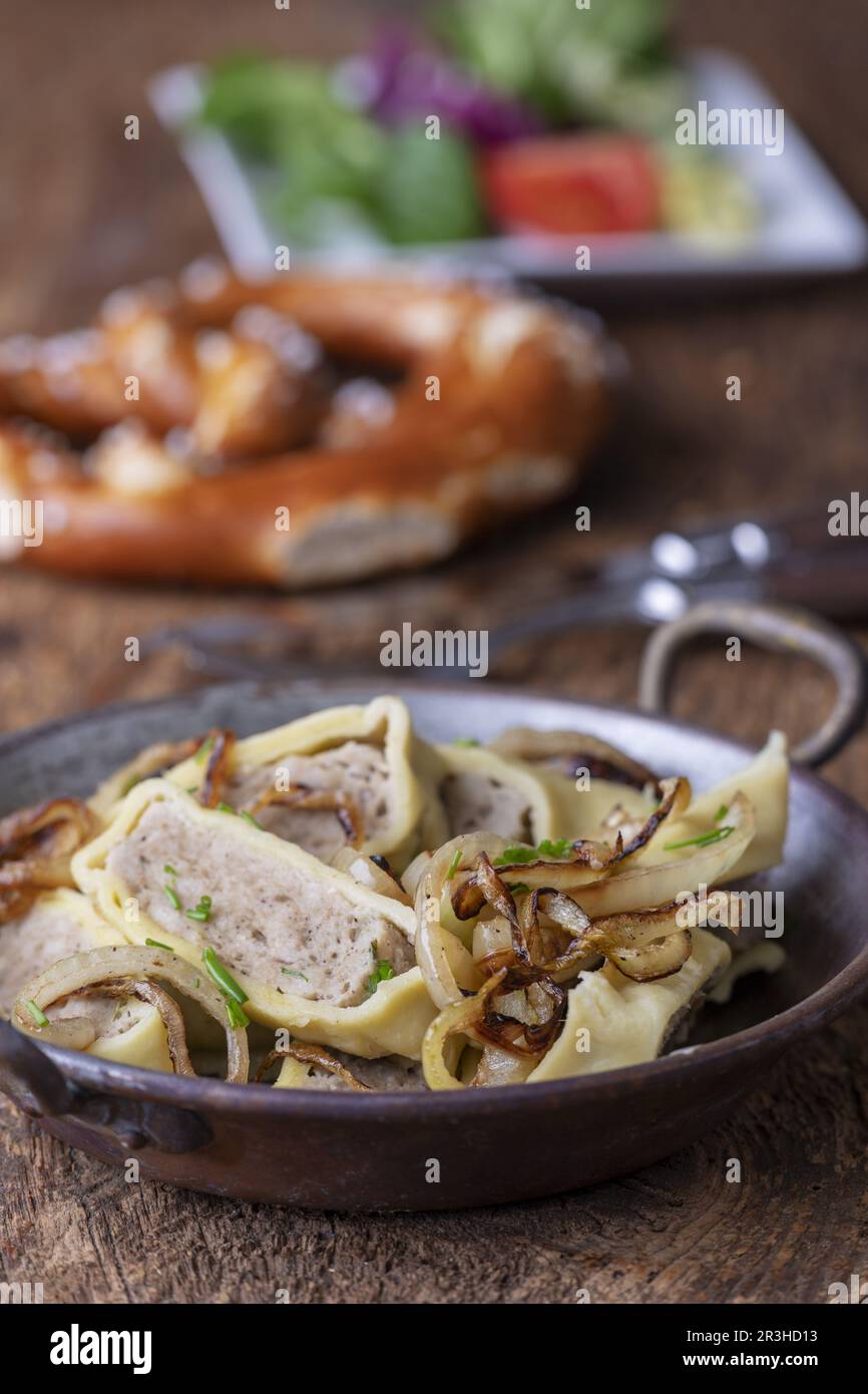 Swabian Maultasche with onions in the pan Stock Photo - Alamy