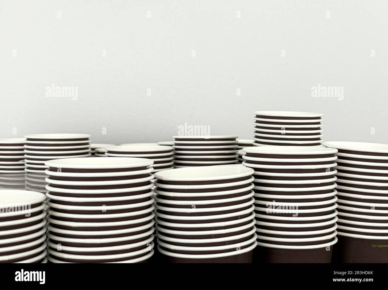 The stack of new take away coffee cups in the minimal cafe or ...